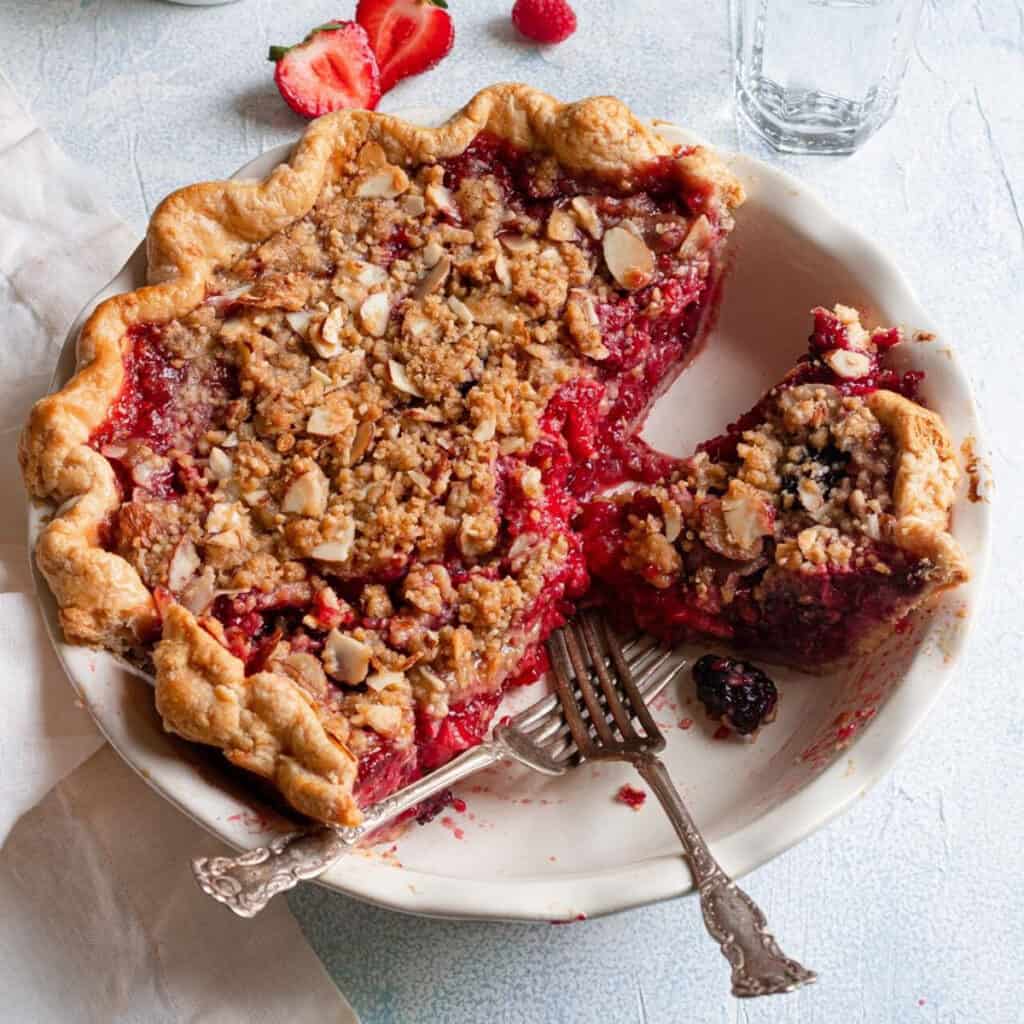 Berry pie topped with nutty streusel and loaded with fresh berries.