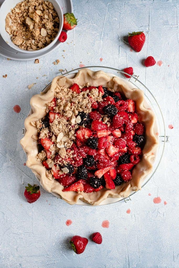 Berry pie topped with nutty streusel and loaded with fresh berries.
