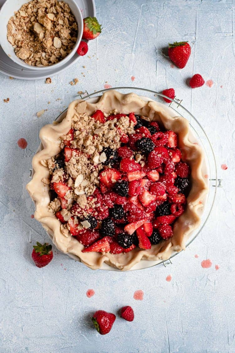 Berry pie topped with nutty streusel and loaded with fresh berries.