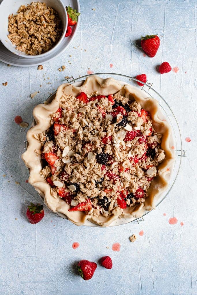 Berry pie topped with nutty streusel and loaded with fresh berries.