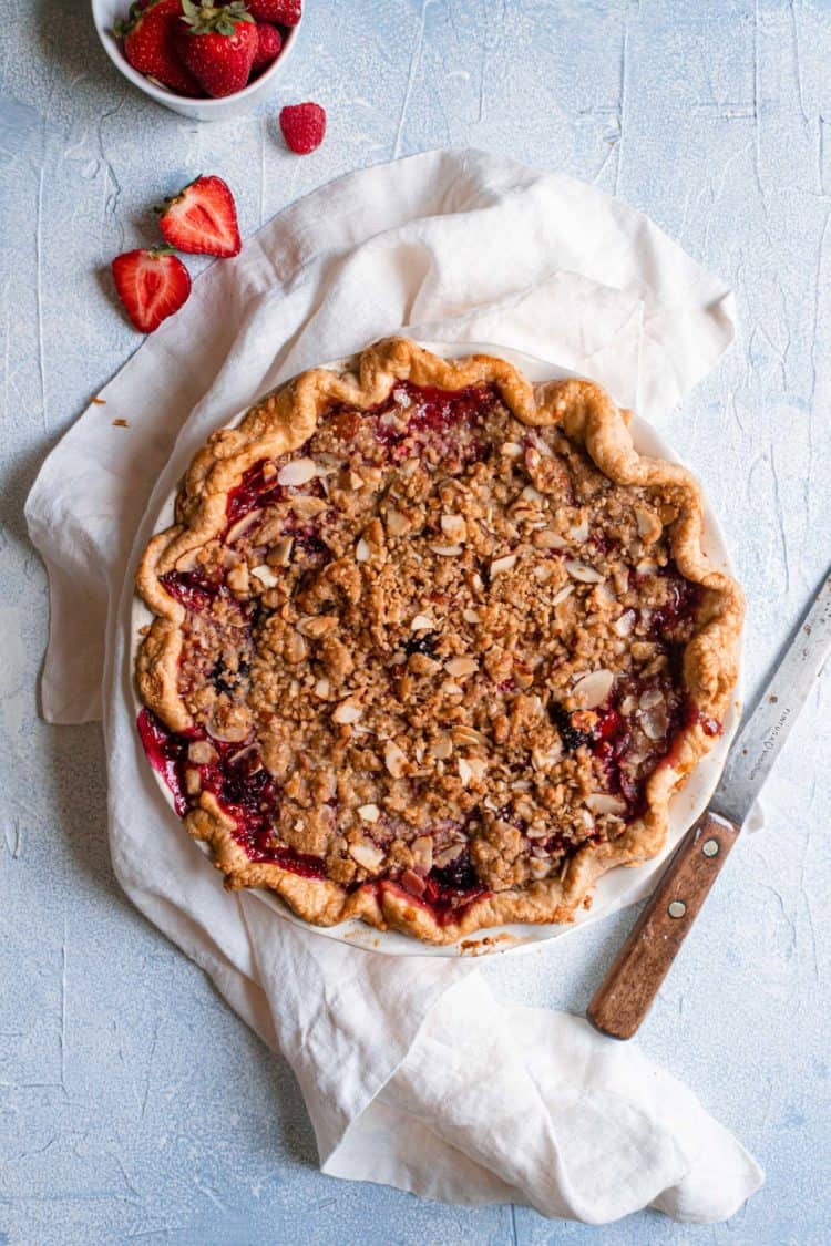 Berry pie topped with nutty streusel and loaded with fresh berries.