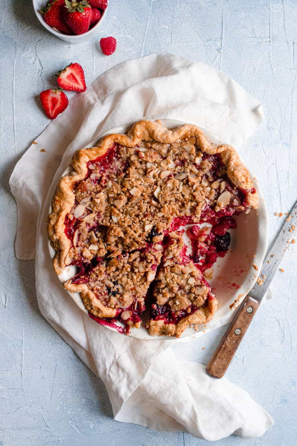 Berry pie topped with nutty streusel and loaded with fresh berries.