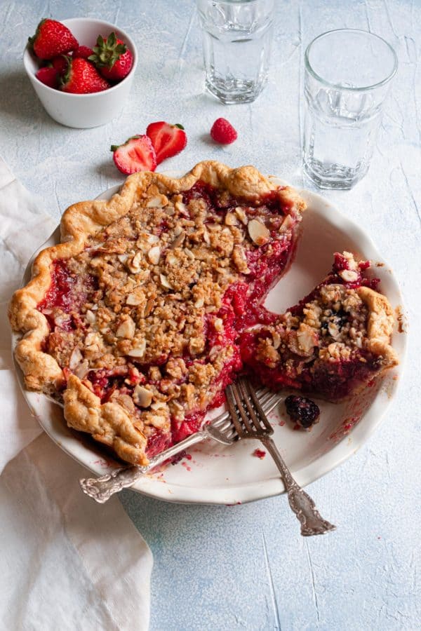 Berry pie topped with nutty streusel and loaded with fresh berries.